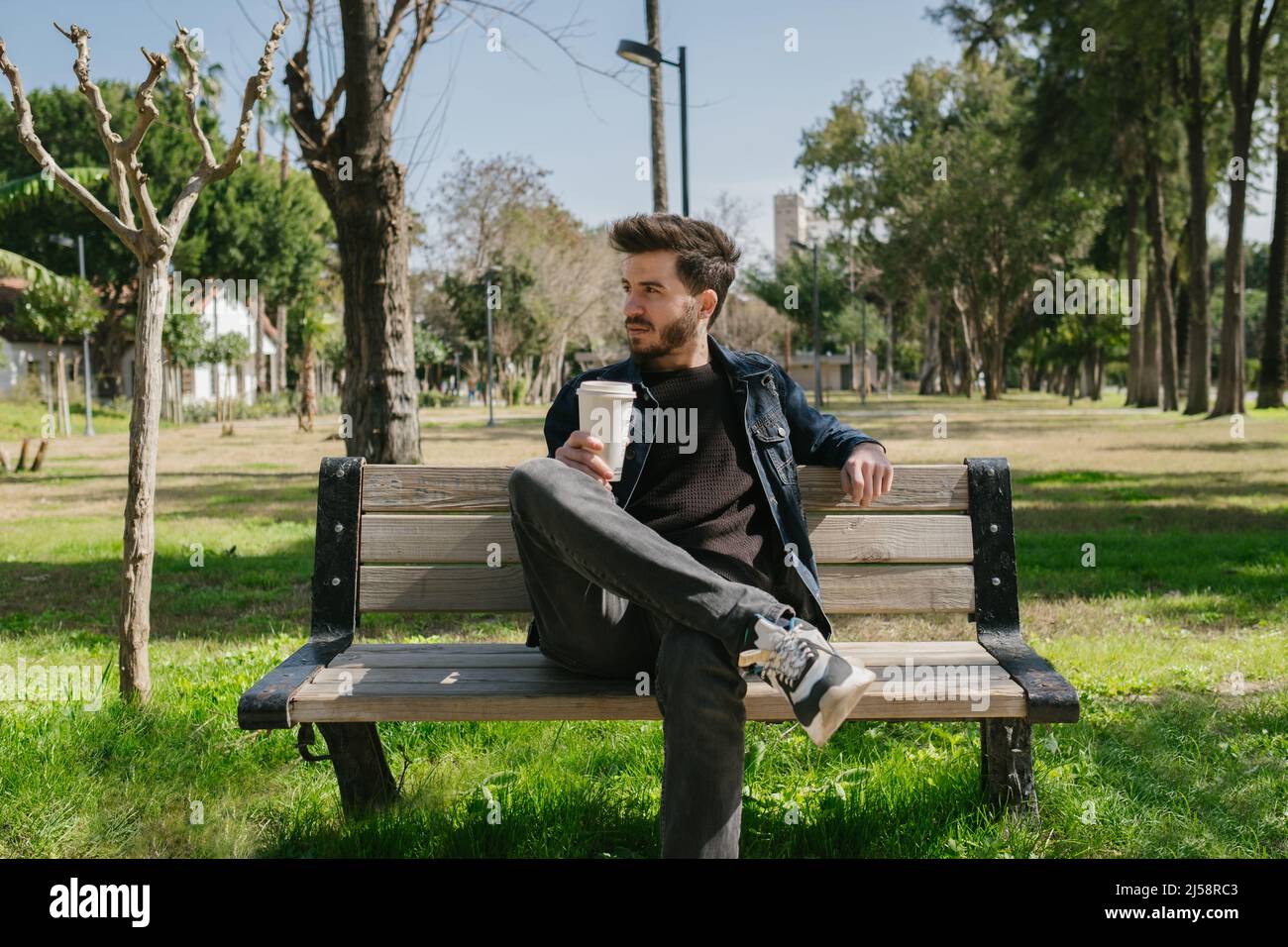 Male model sitting legs crossed hi-res stock photography and images - Alamy