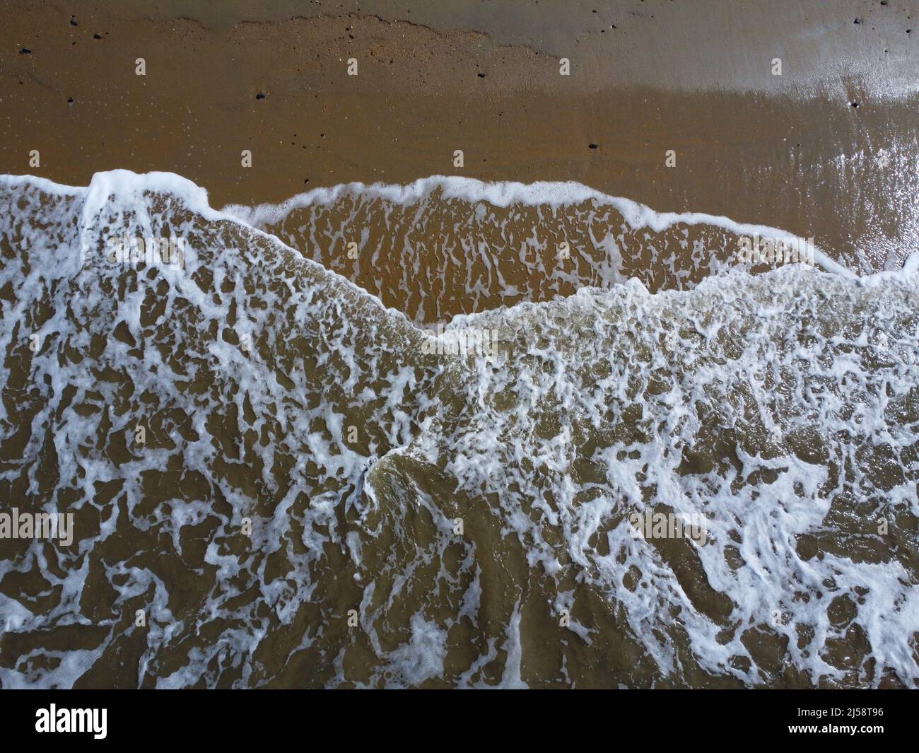 Aerial down view of whit waves washing on the beach Stock Photo - Alamy