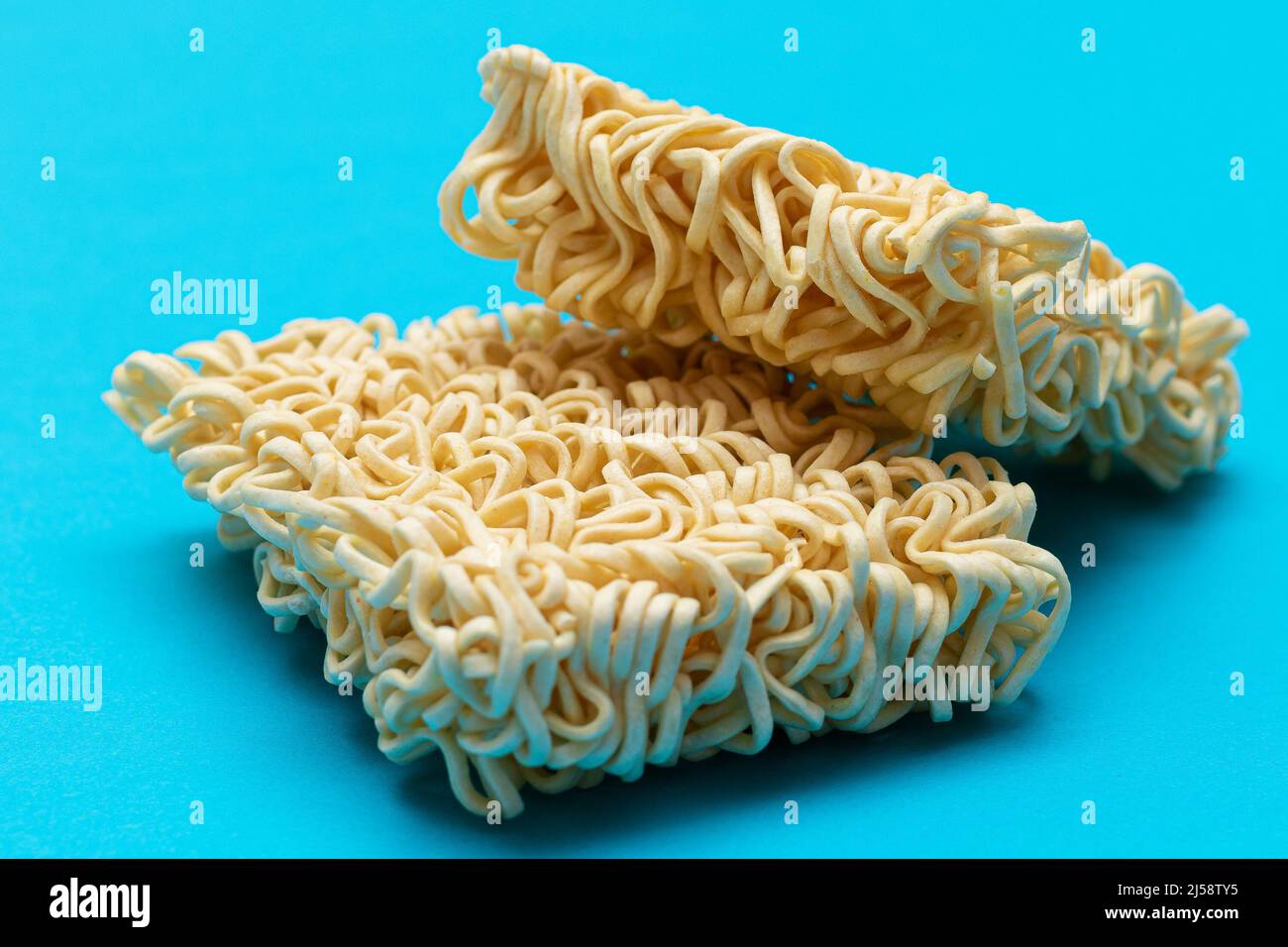 Uncooked Instant Noodles on Blue Background. Raw Pasta. Dry Asian Fast ...