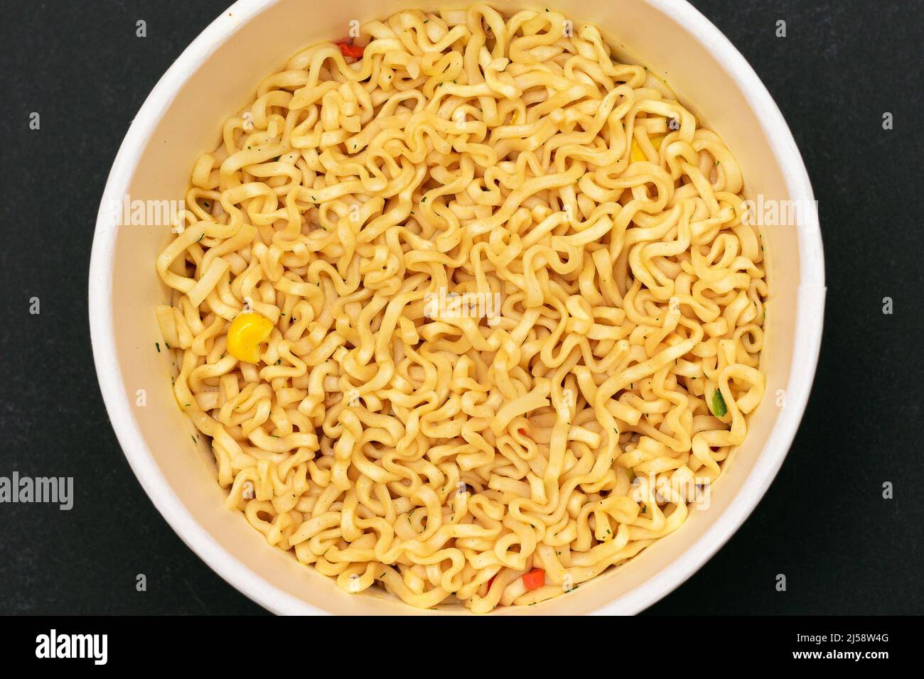 Instant Noodles in Disposable Cup on Black Background - Top View. Asian ...