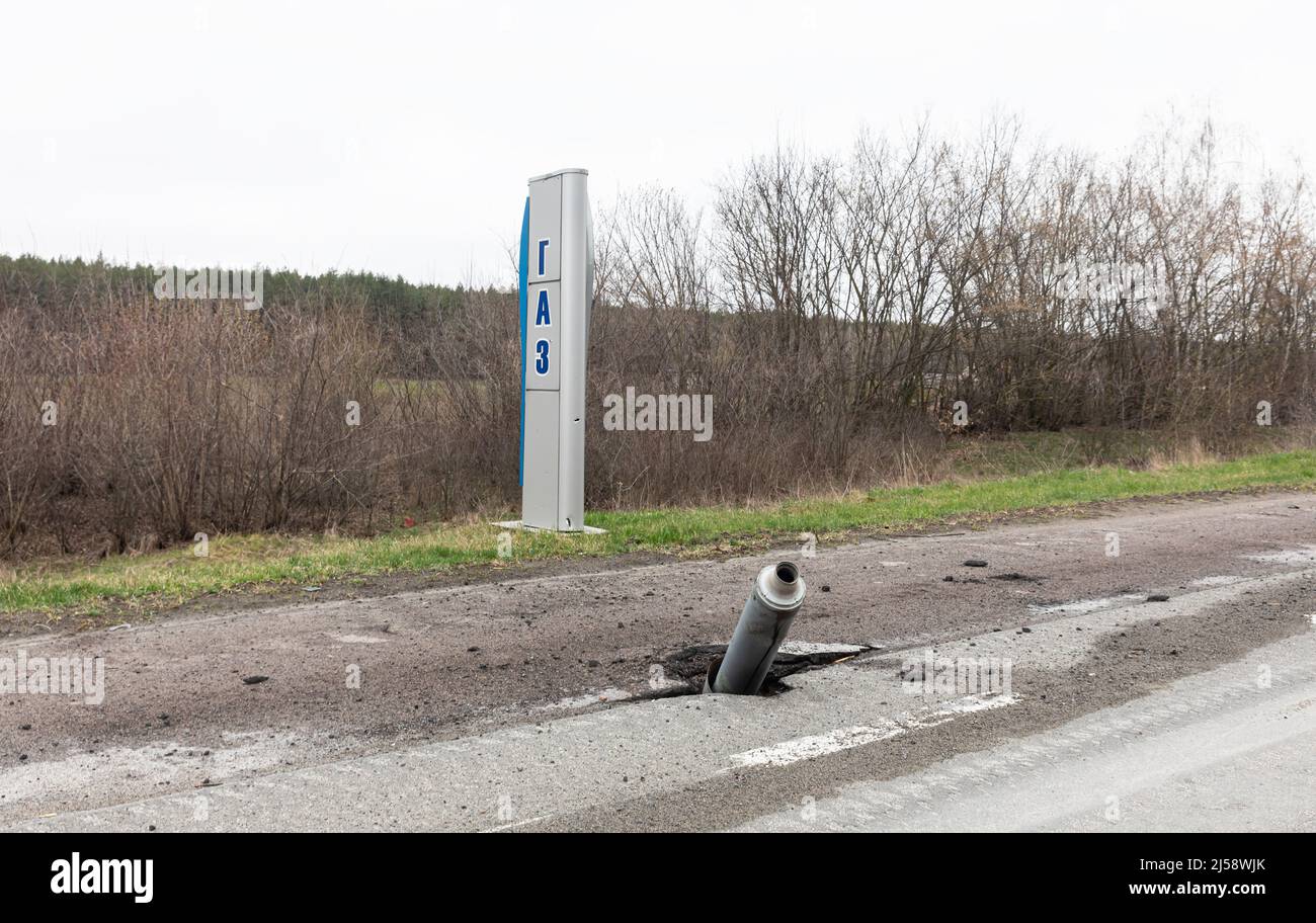 War in Ukraine. An unexploded rocket broke through the asphalt on the ...