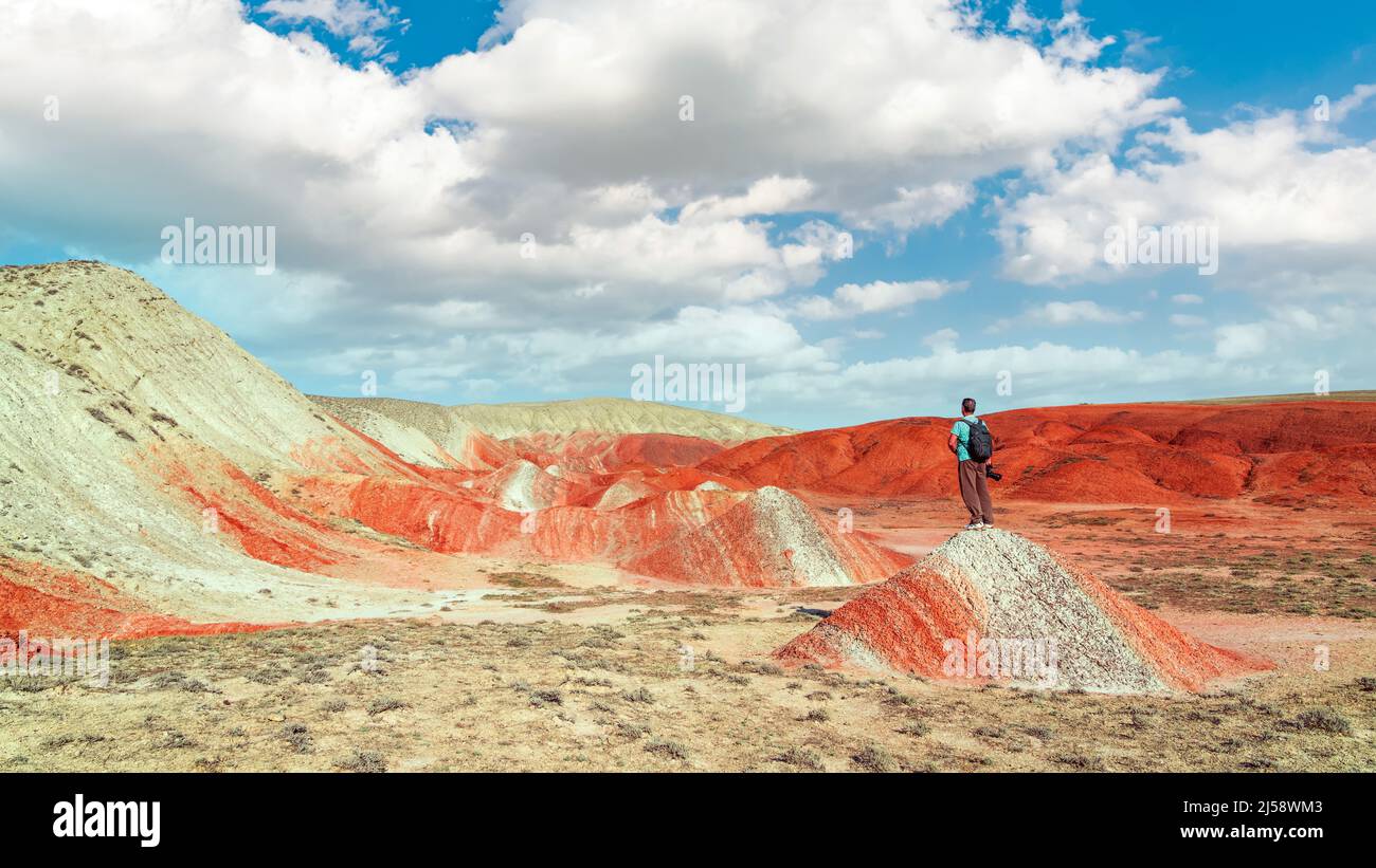 Red sand mountains in the desert area Stock Photo - Alamy