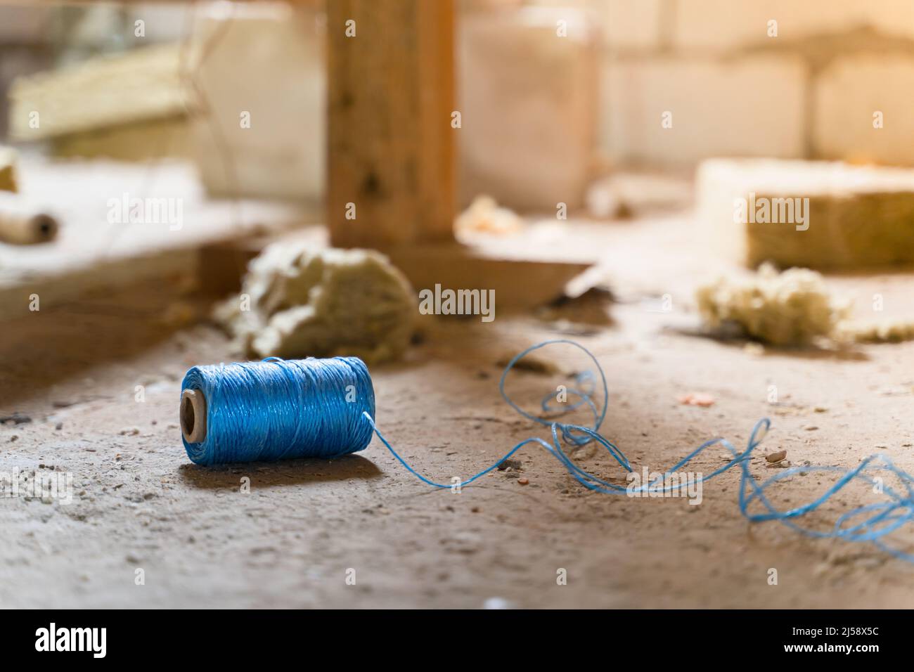 Blue polypropylene construction thread lies on the floor at a ...