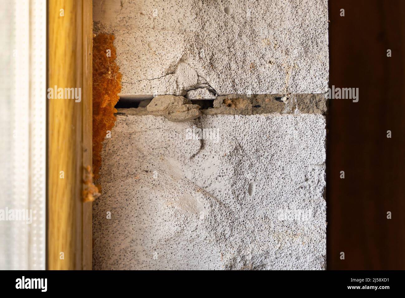 The gap between the window and the wall is filled with mounting foam ...