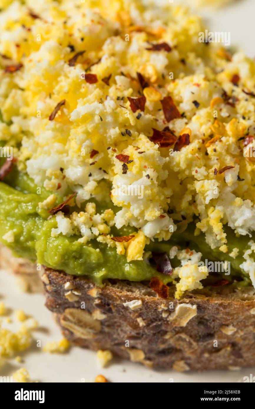 Homemade Trendy Grated Egg Toast with Avocado and Salt Stock Photo - Alamy