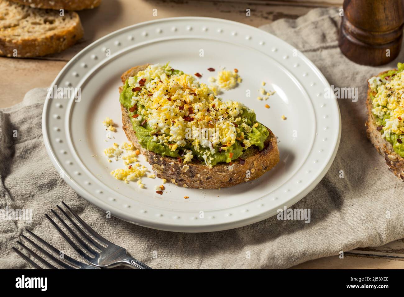 Homemade Trendy Grated Egg Toast with Avocado and Salt Stock Photo - Alamy