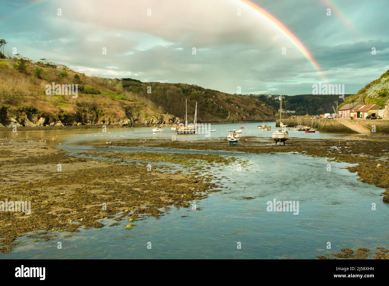 Fishguard bay Pembrokshire after rain with double rainbow Stock Photo ...