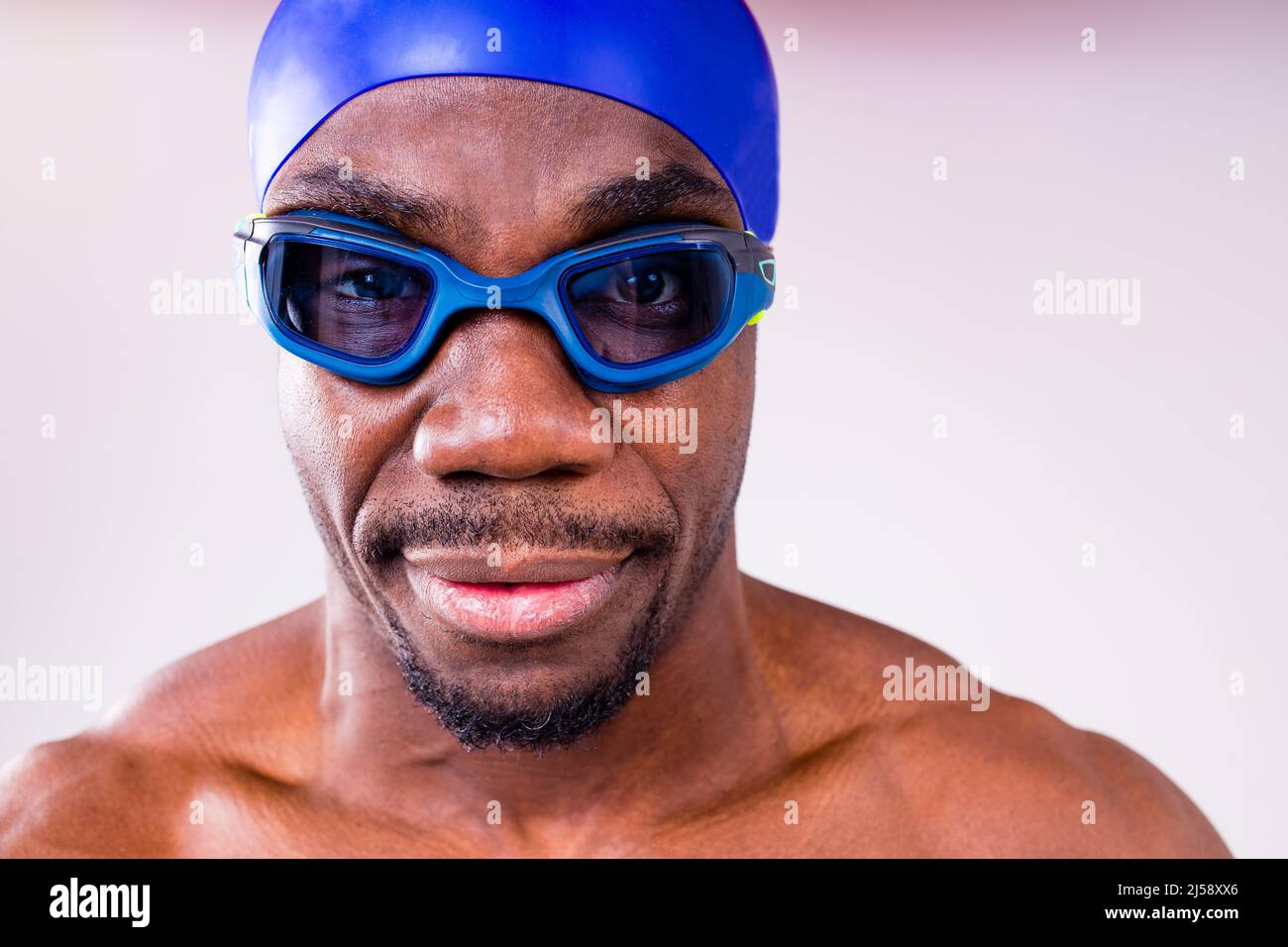 afro latin mixed race man swimmer getting ready to start swimming ...