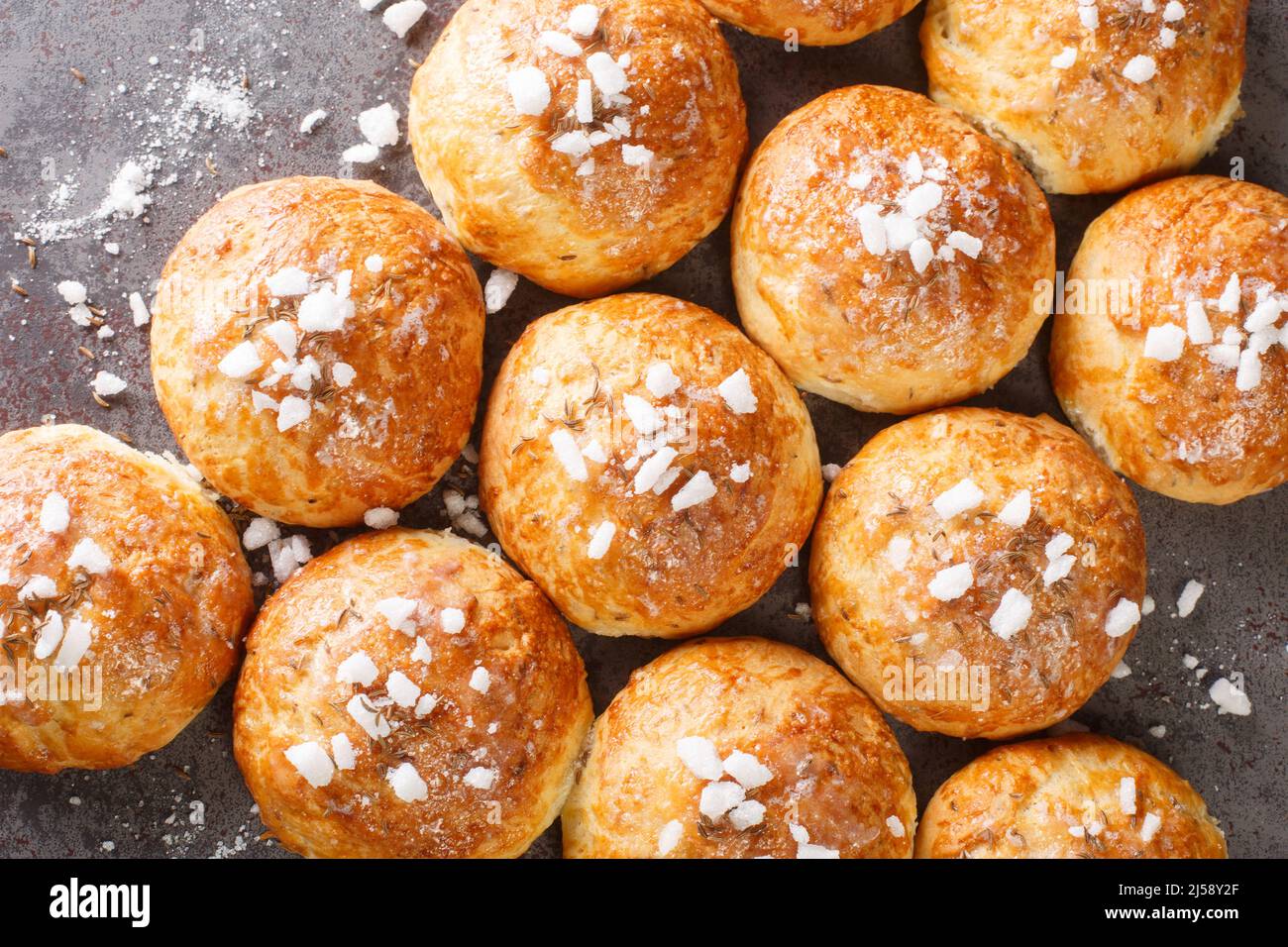 Delicious crispy hot bath bun with cumin and sugar close-up on the ...