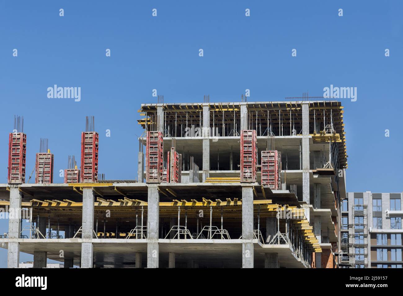 Unfinished cement building of skyscrapers complex Stock Photo - Alamy