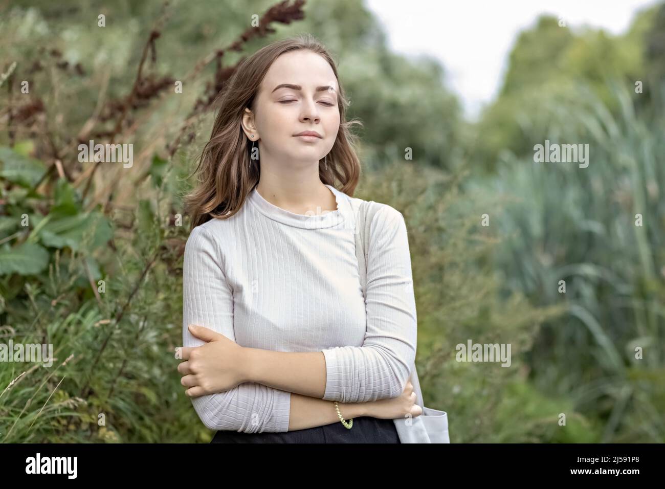 Portrait of a young teenager girl in the park. Spring Stock Photo - Alamy