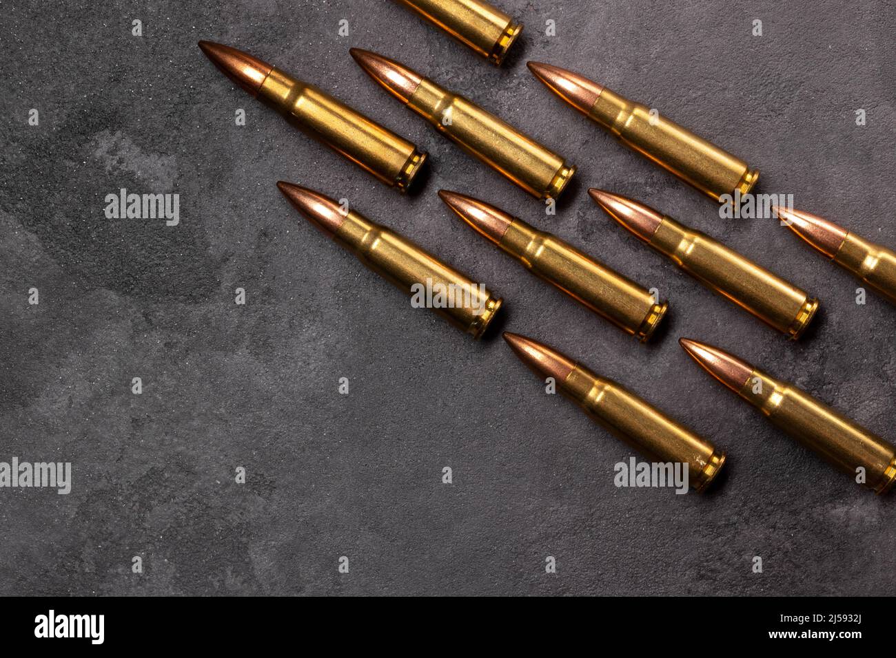 Bullets on gray background. Cartridges 7.62 caliber for Kalashnikov ...