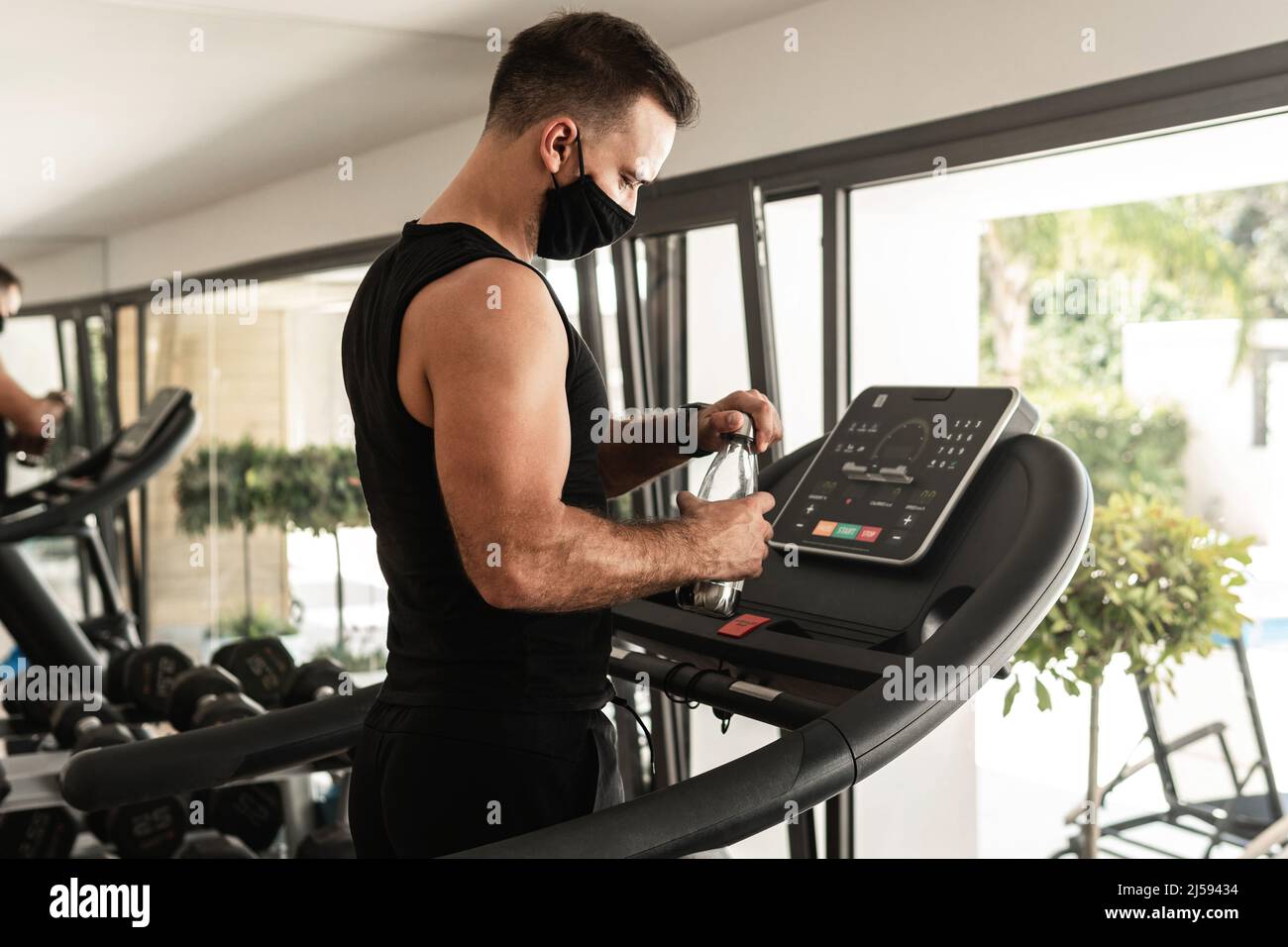Young man treadmill mask hi-res stock photography and images - Alamy