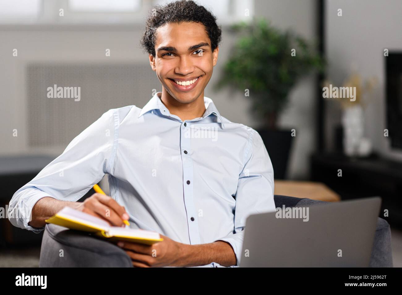 Busy multi-ethnic freelancer guy using laptop computer for work or ...