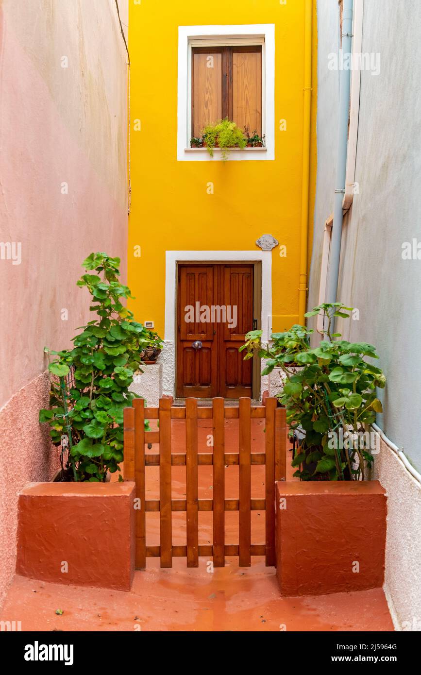 Yellow house front, Bosa, Sardinia, Italy Stock Photo - Alamy
