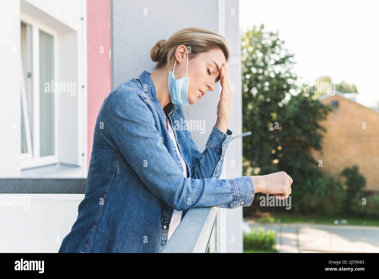 Tired woman with prevention mask going outside to breathe with a fresh ...