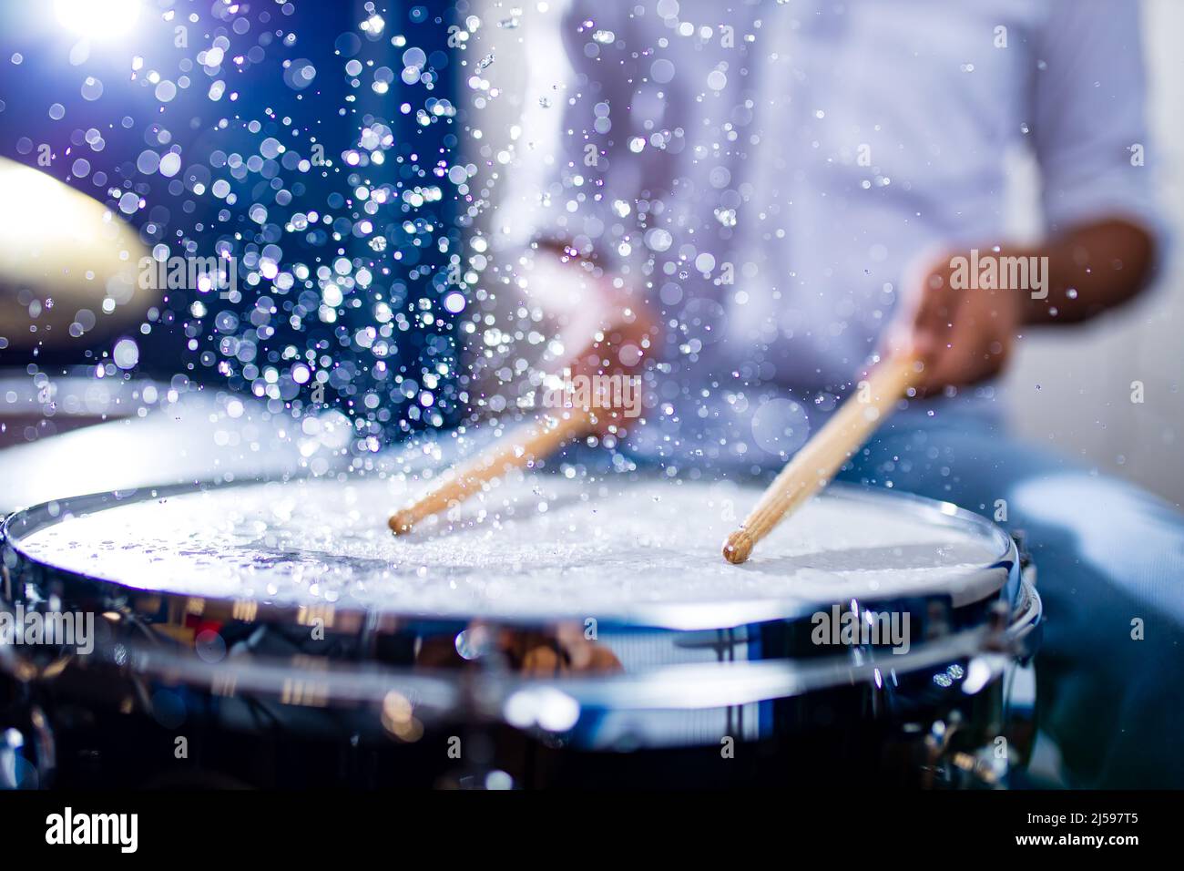 indian man playing the drums sticks close-up in recording studio Stock ...