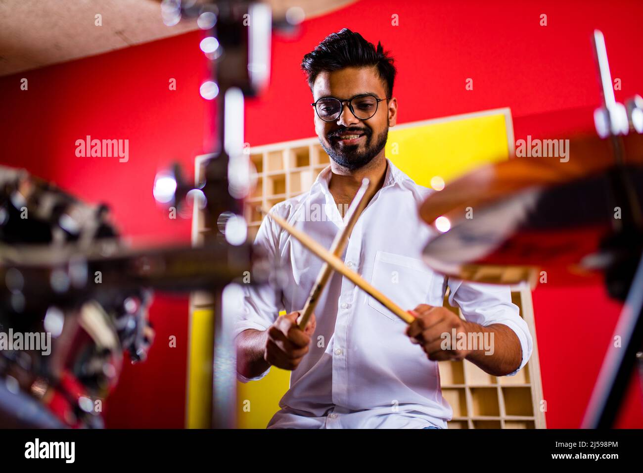 Young arabic man in a professional recording studio Stock Photo - Alamy