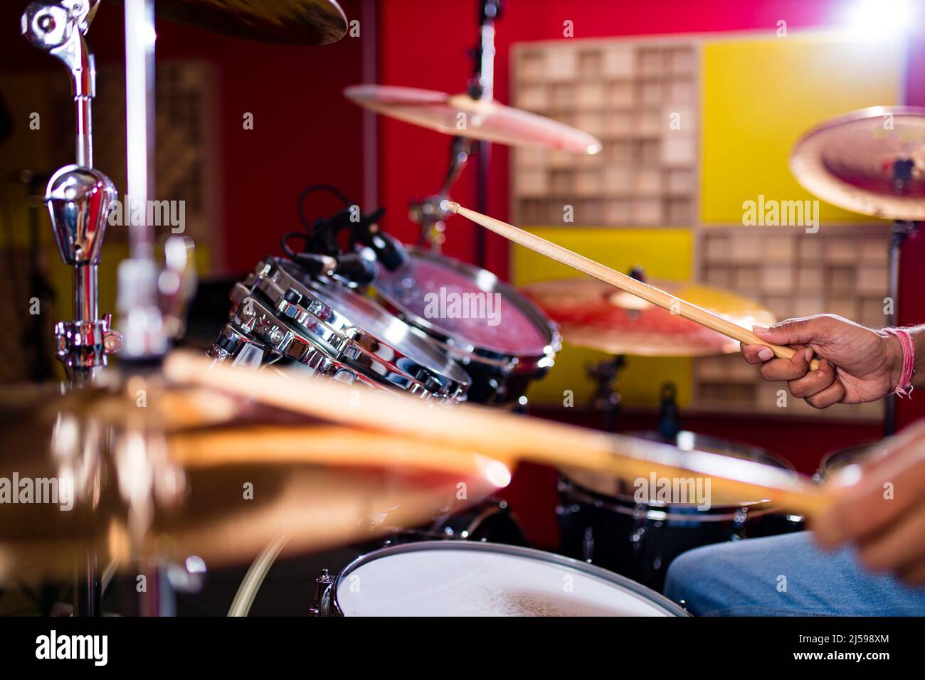 Attractive Teenage Drummer with Drumsticks in recording studio Stock ...