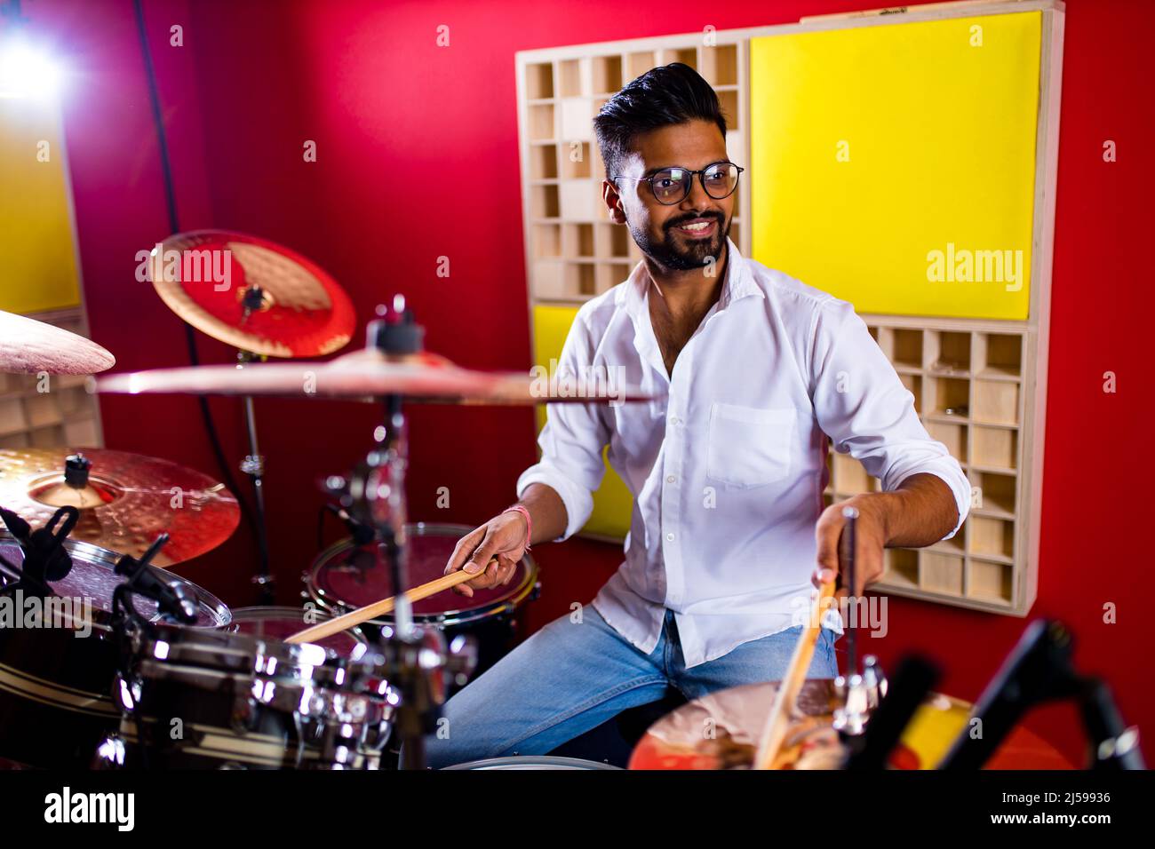 Young arabic man in a professional recording studio Stock Photo - Alamy