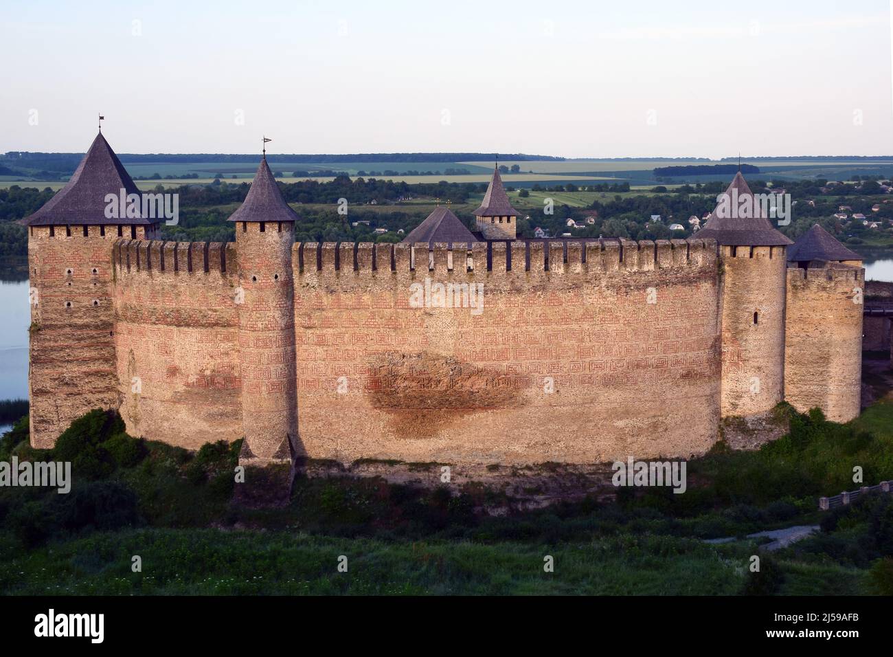 Medieval stone fortress with several towers with battlements strong ...