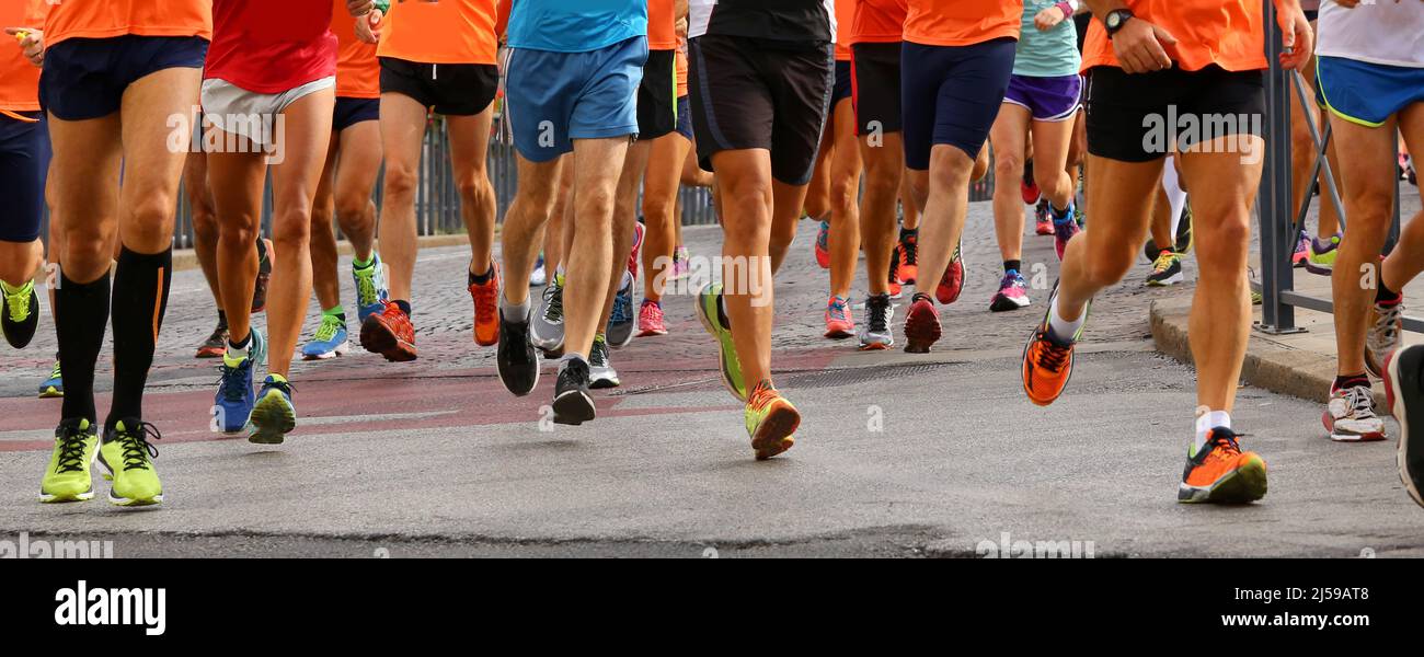 many legs of runners athletes during the foot race in the city Stock ...