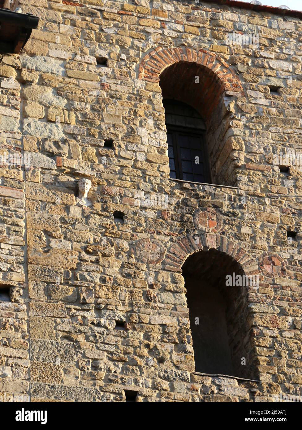 statue with the face of a woman named BERTA on the wall of the ancient ...