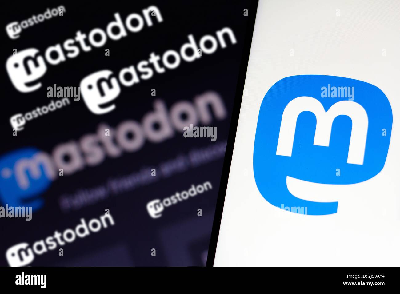 In this photo illustration, a woman holds a smartphone with the ...