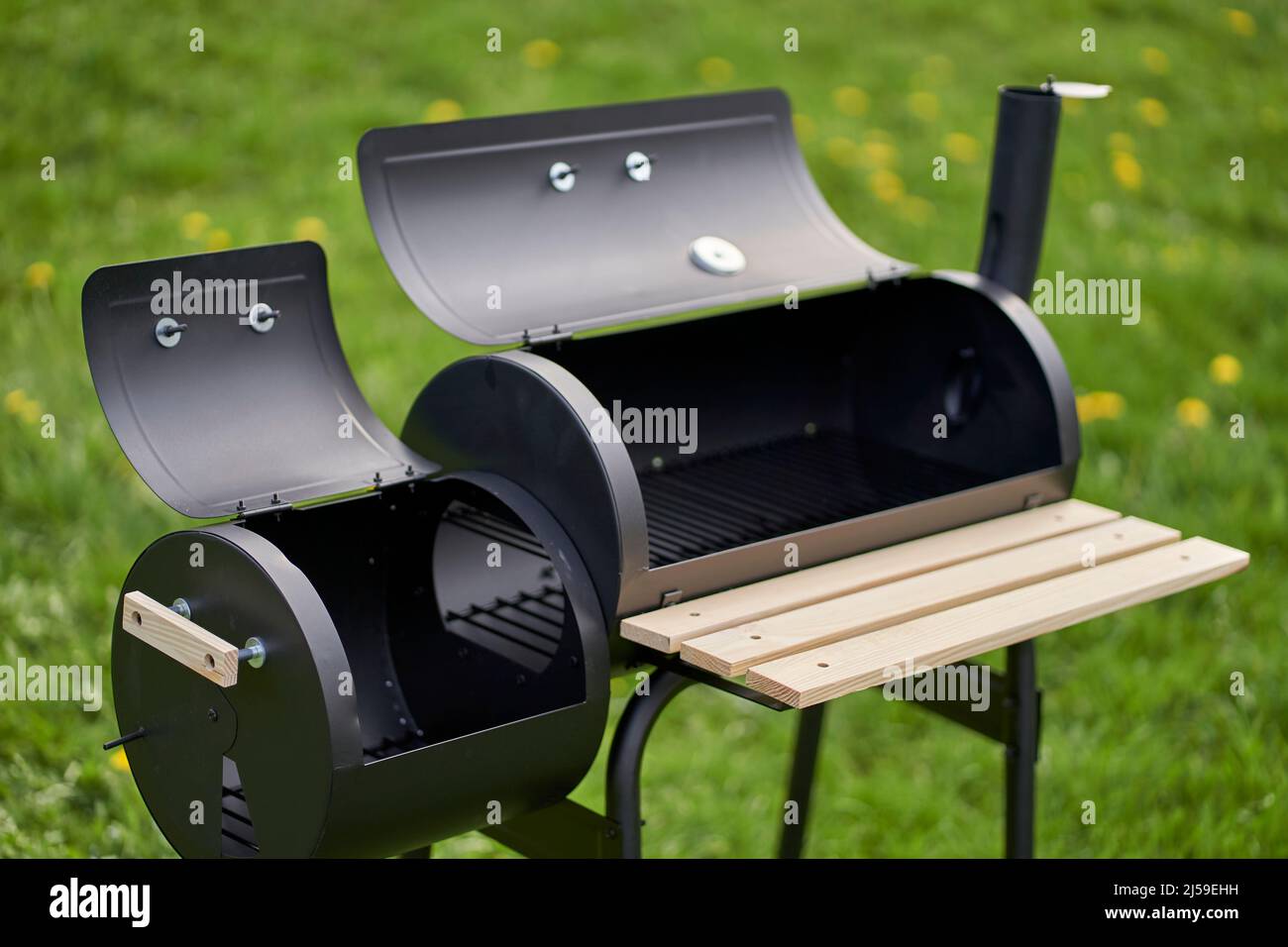 New smoker barbecue grill. Equipment for cooking and smoking. Opened ...