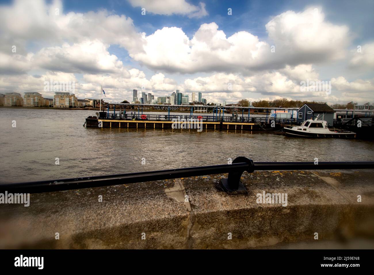 View across the Thames river in London from the Greenwich waterfront ...