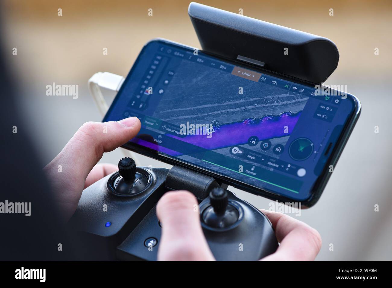 Pilot remotely controls the Drone and explores objects with thermal ...