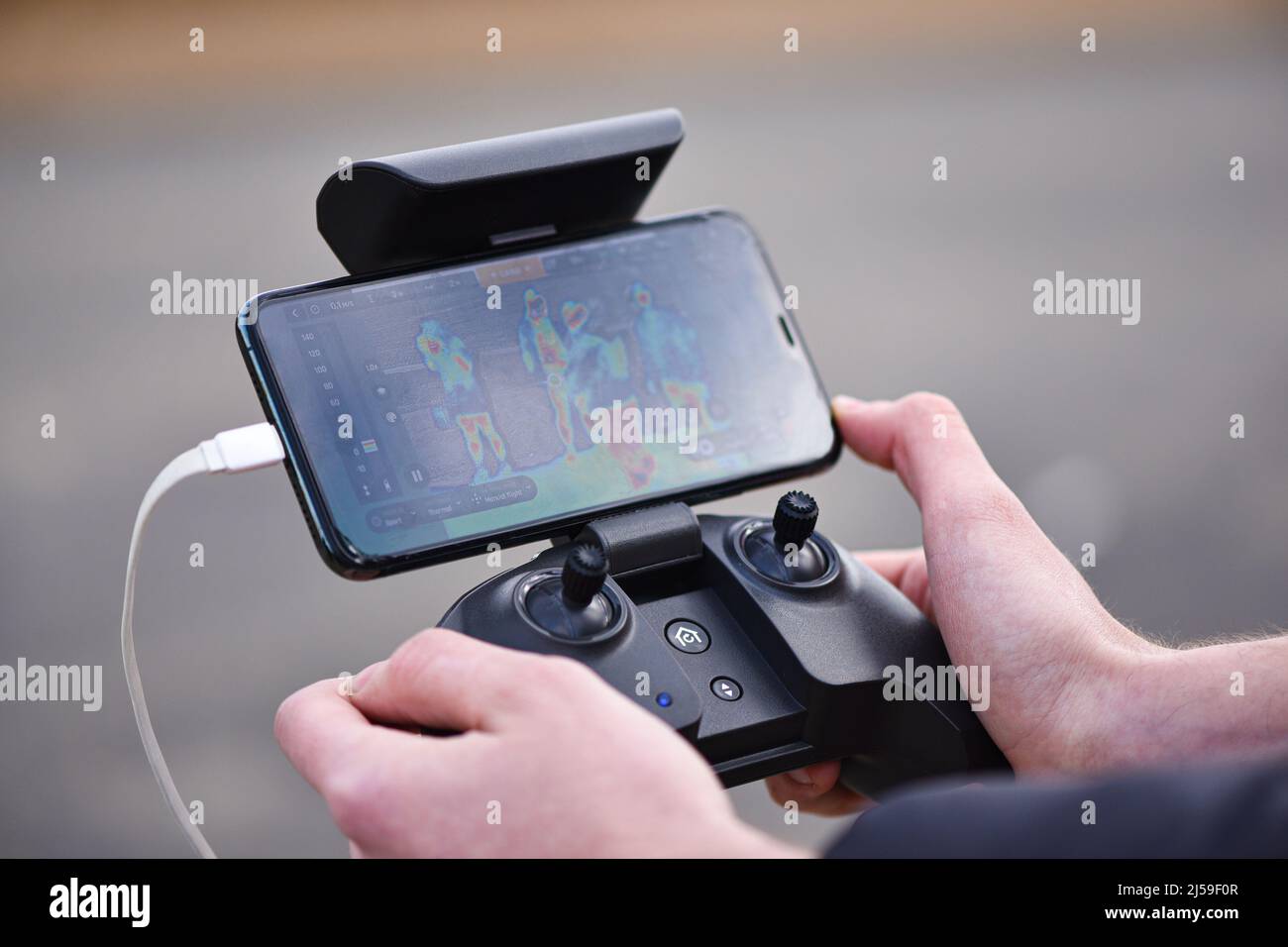 Pilot remotely controls the Drone and explores objects with thermal ...