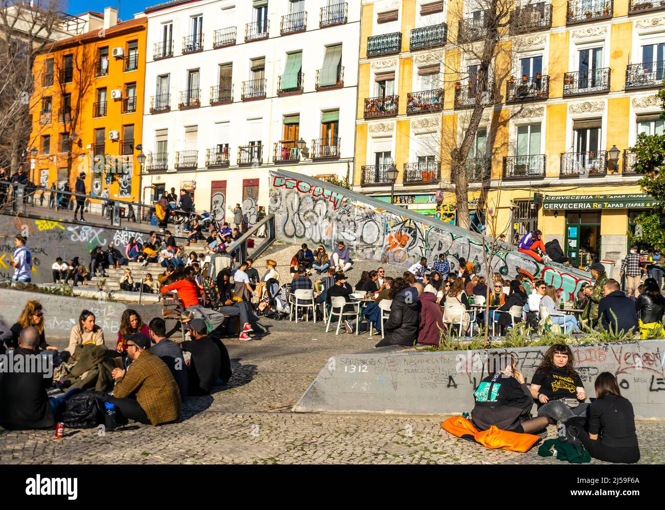 Youth young people students hanging out at Plaza de Arturo Barea, known ...