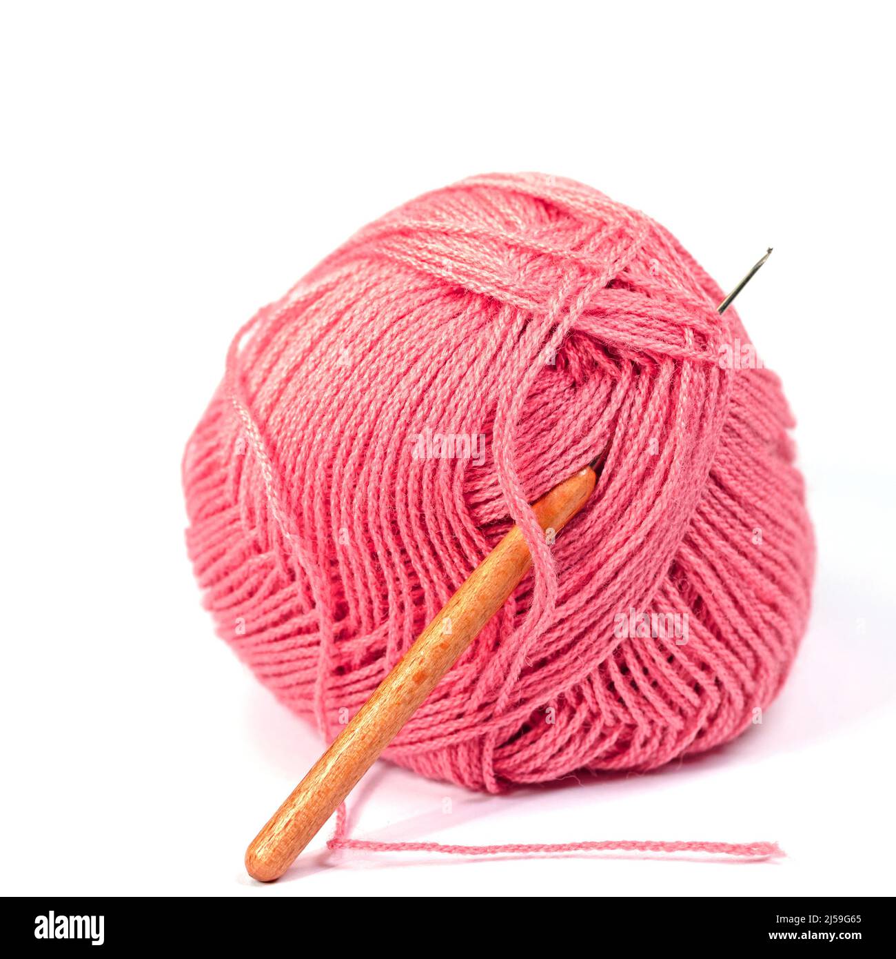 Red crochet yarn against white background Stock Photo - Alamy
