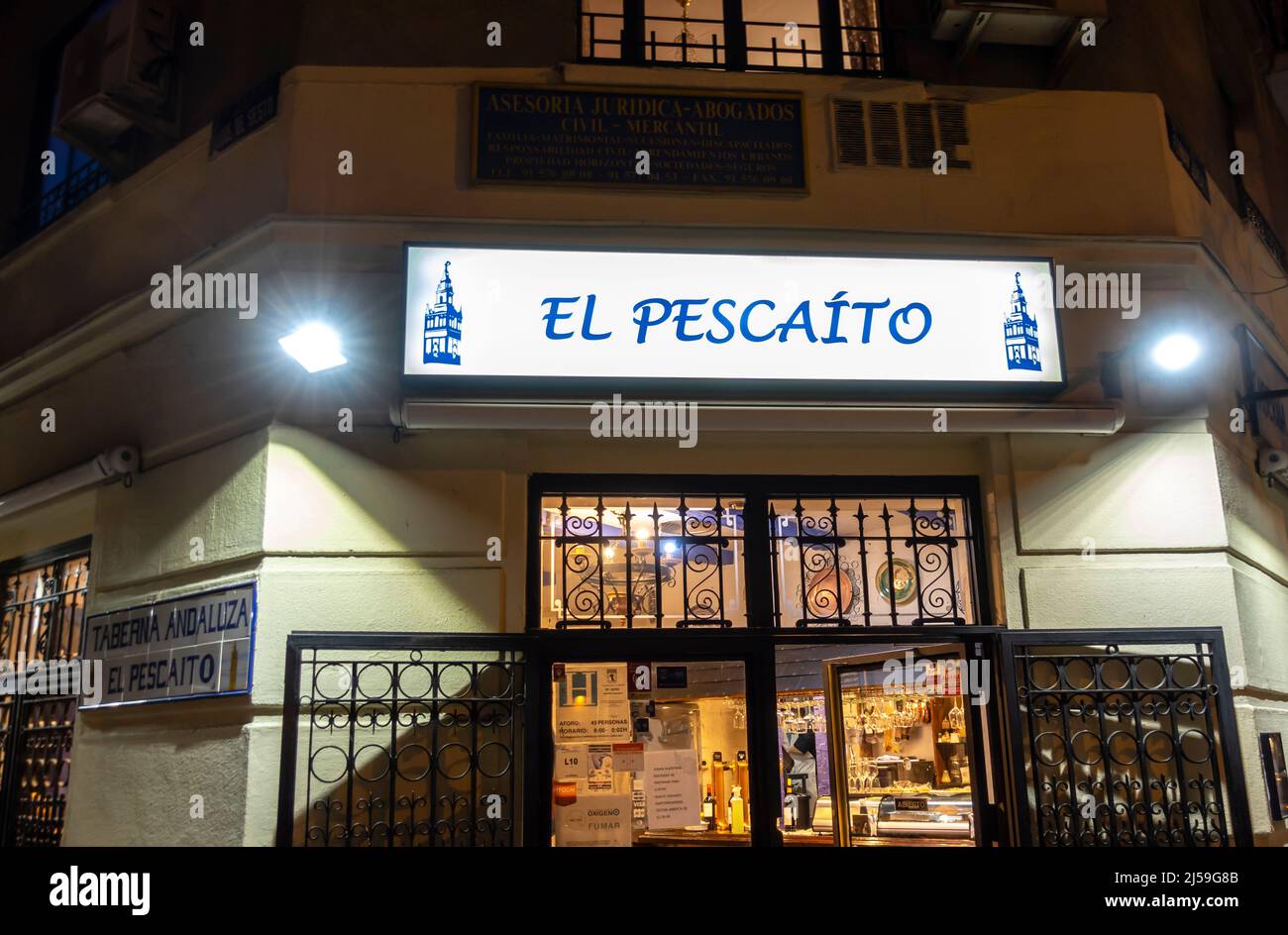 Restaurant El Pescaíto, Andalucian cuisine, lit up sign. Madrid, Spain ...