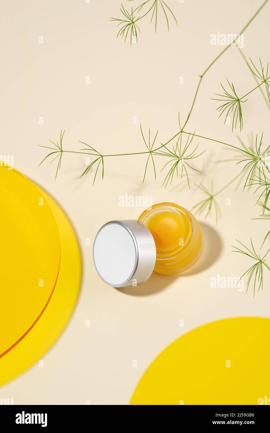 Hygienic container for lip balms, lying on a natural beige background ...