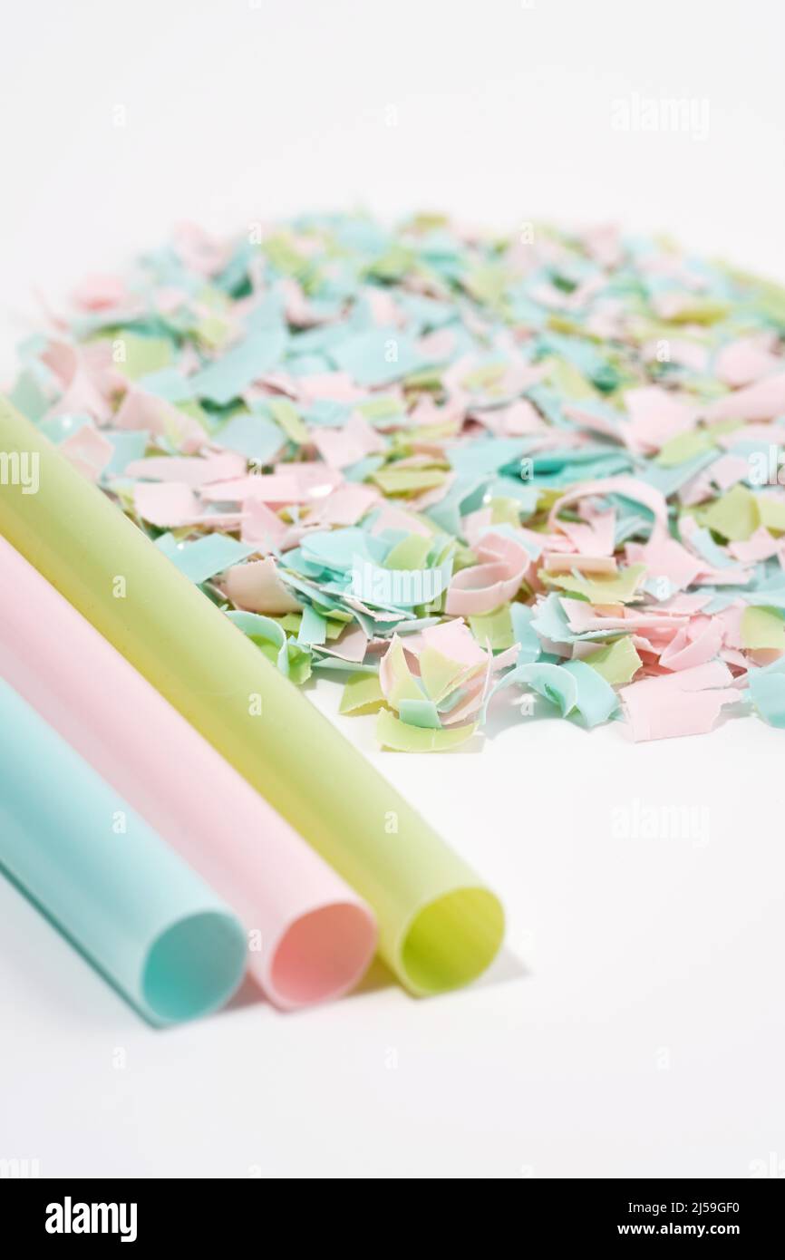 Drinking straws and microplastics on a white background. Impact of ...