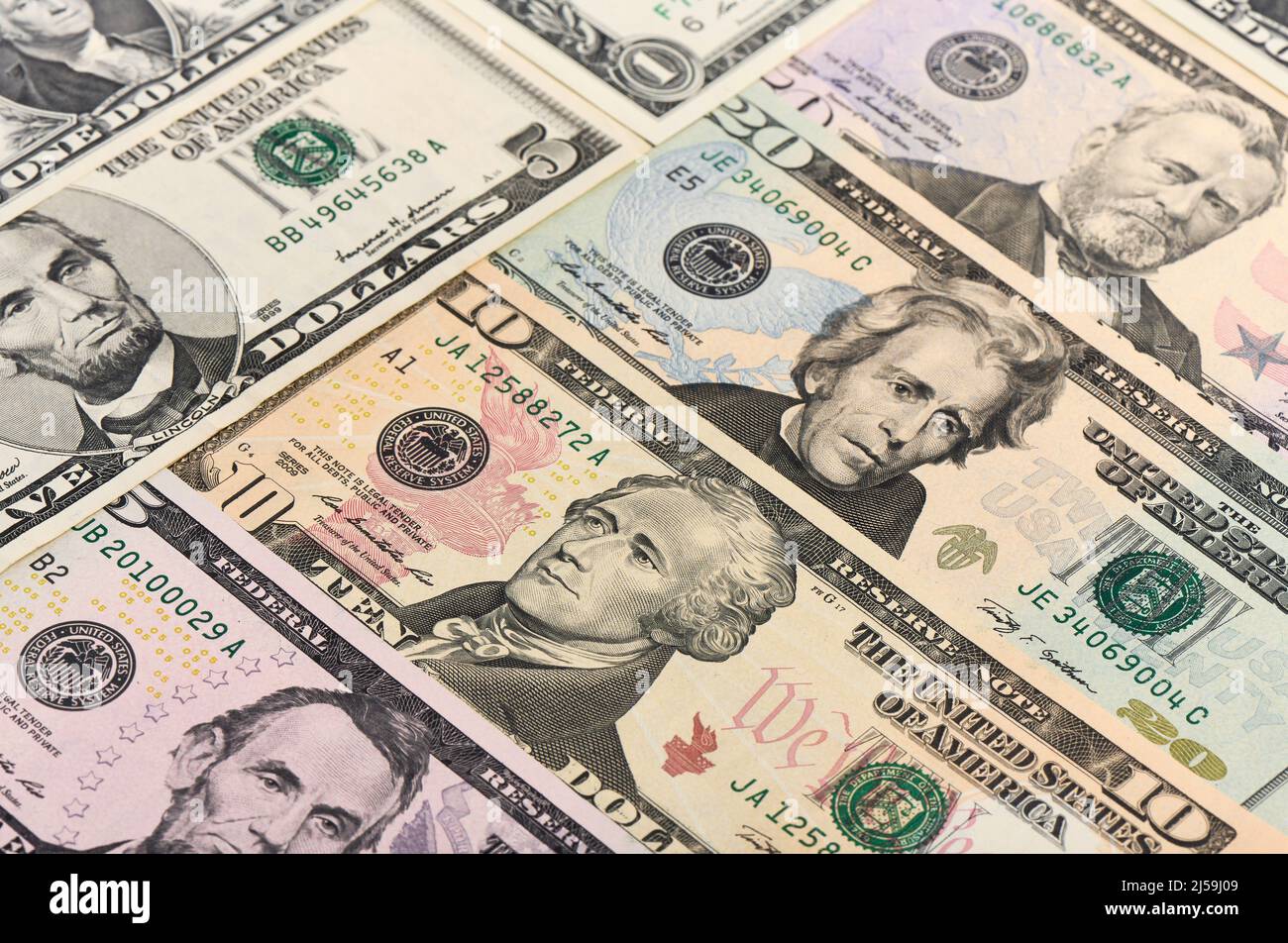 Background of cash dollar bills of different denominations close-up ...
