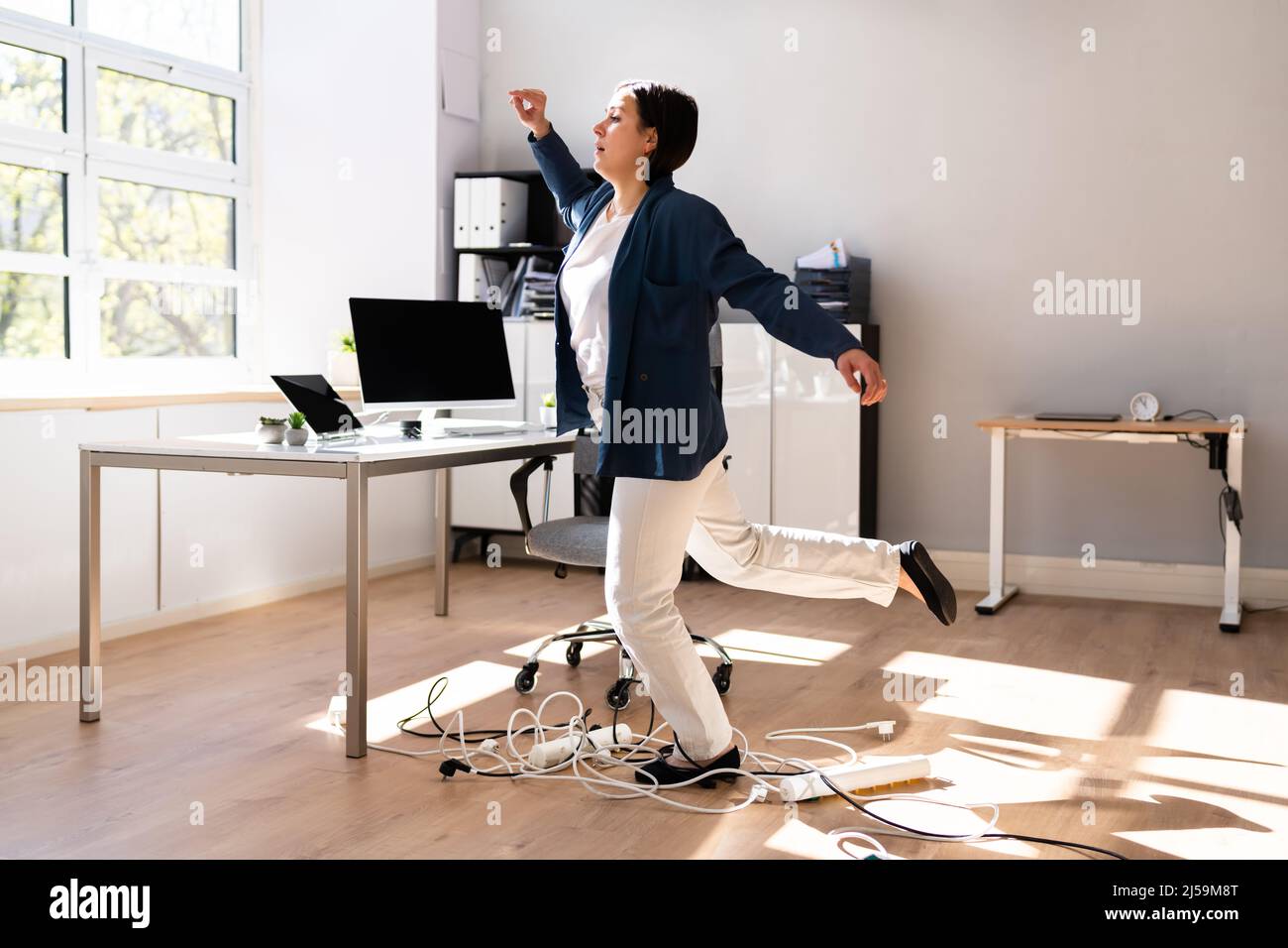 Stumble And Fall Over Wire In Office Stock Photo - Alamy