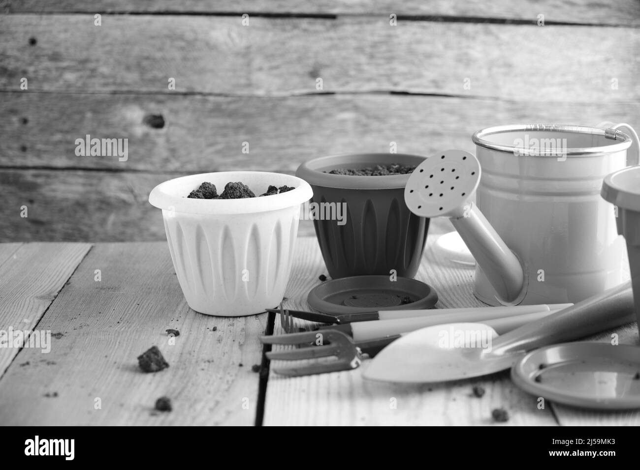 Flower pots, garden tools and watering can, planting flowers and ...