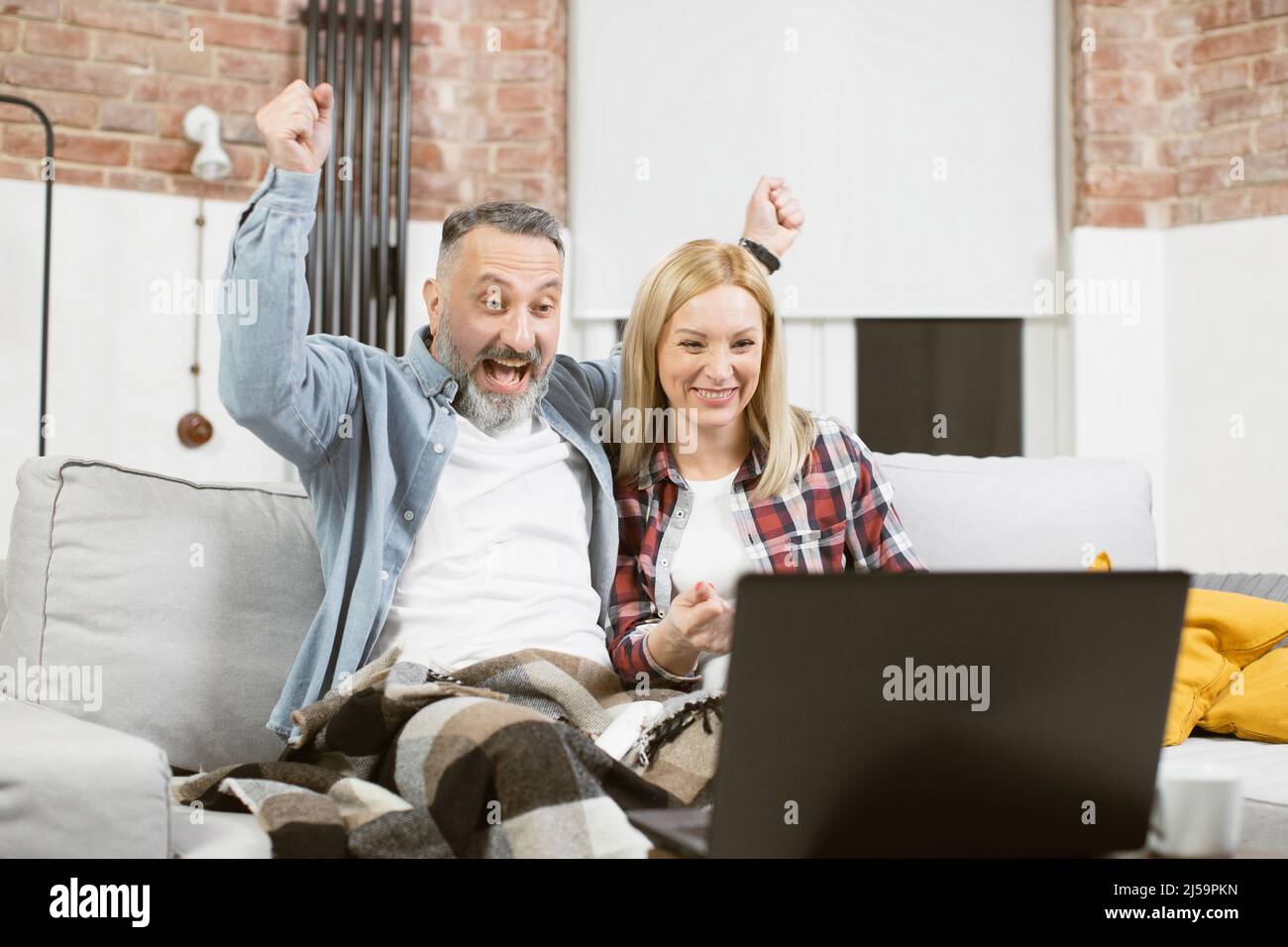 Handsome mature man and beautiful woman showing yes gesture while ...