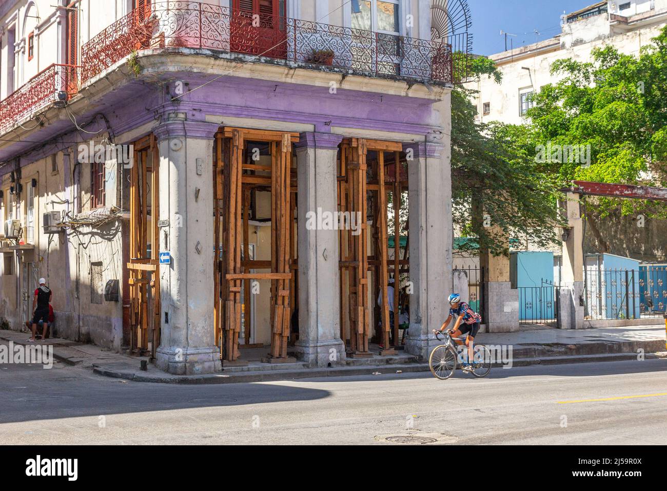 An old building in danger of collapsing is supported by temporary ...