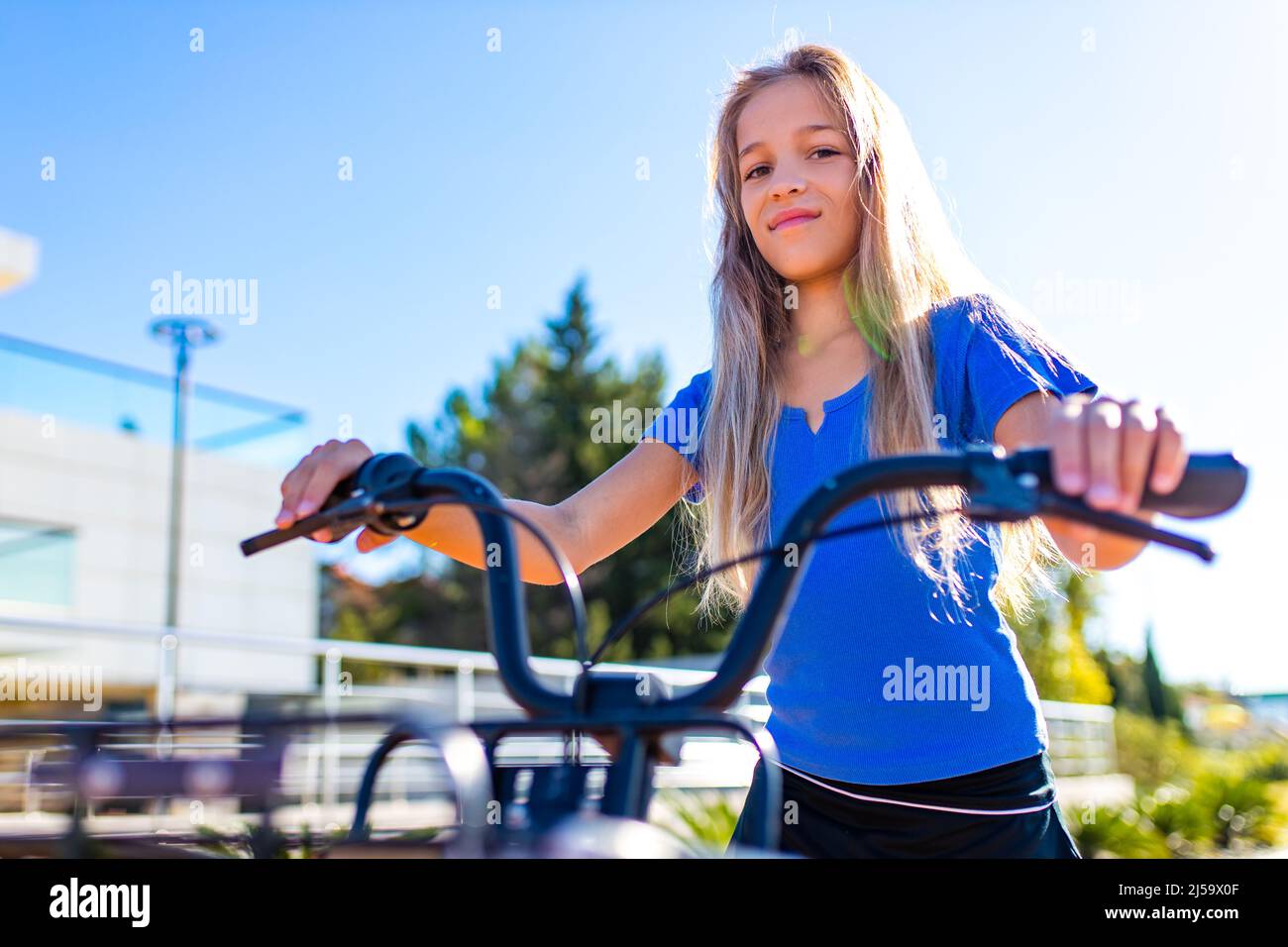 Girl having fun riding bicycle hi-res stock photography and images - Alamy