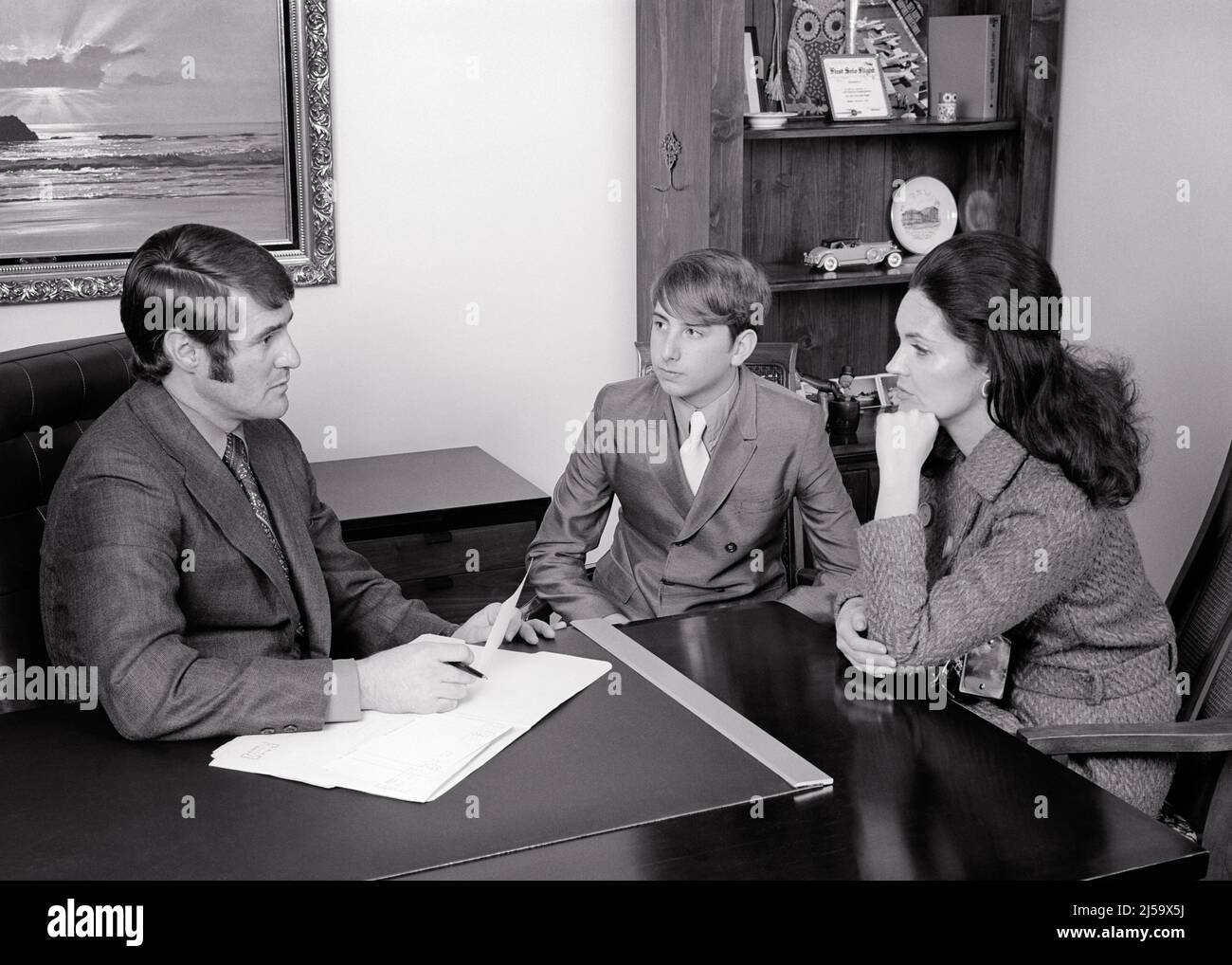 1970s MOTHER AND TEENAGE SON HAVING A CONVERSATION WITH SCHOOL ...