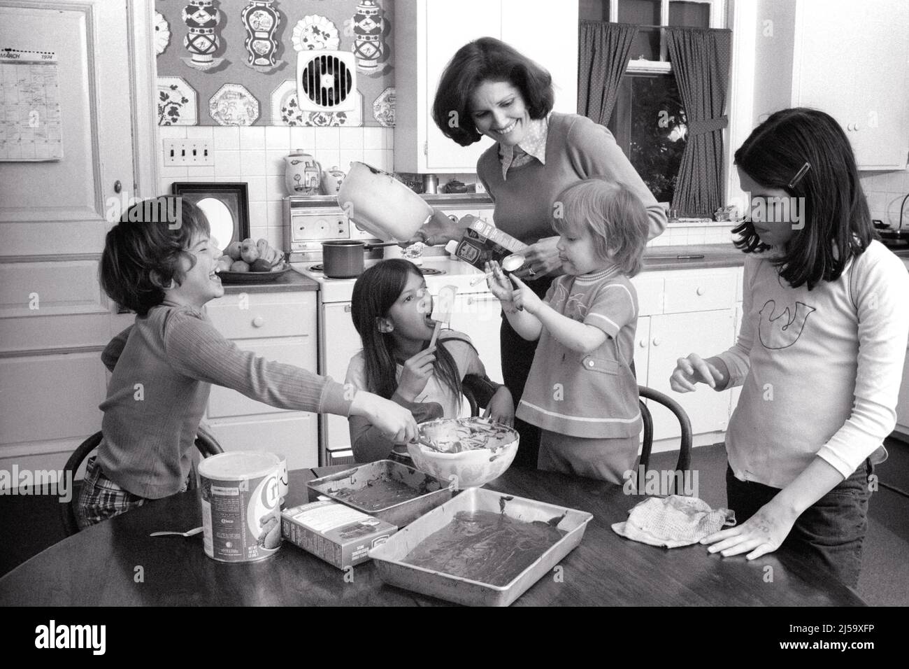 1970s MOTHER AND FOUR CHILDREN BOY AND THREE GIRLS IN THE KITCHEN ...