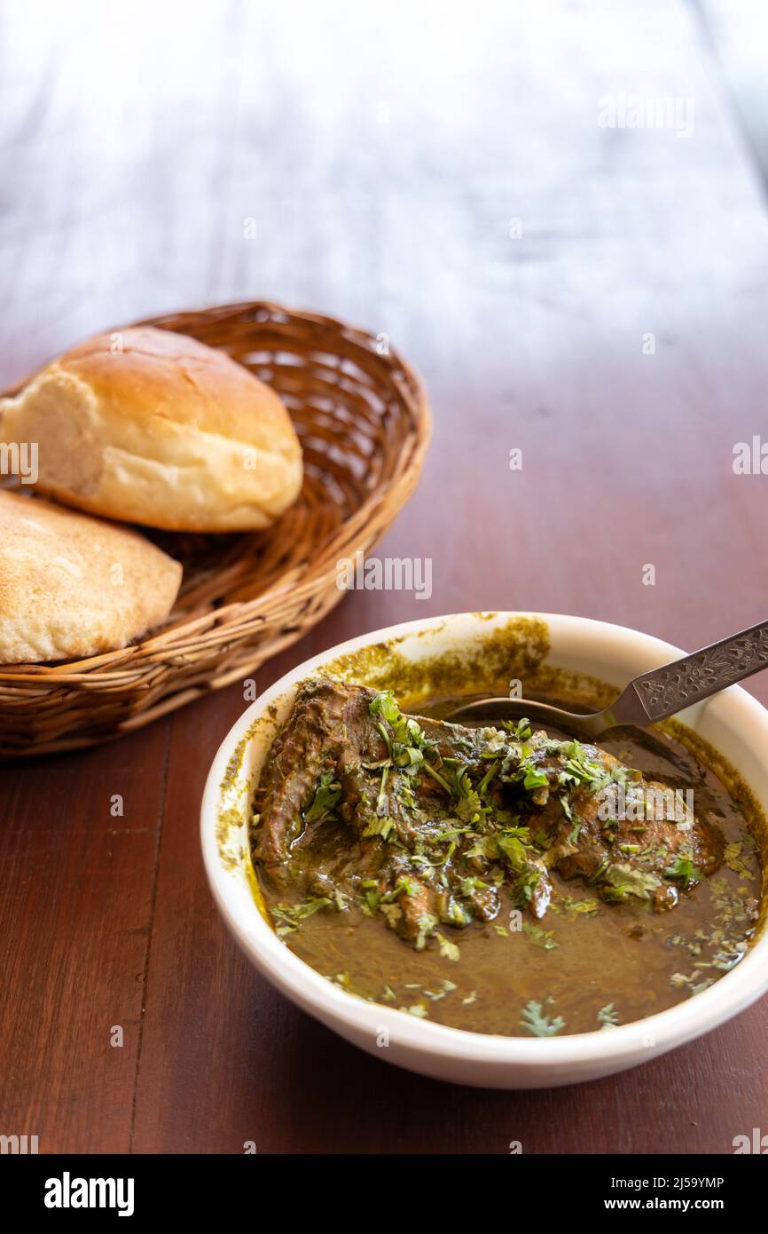 Authentic Goan dish Chicken Cafreal served with Goan bread Stock Photo ...