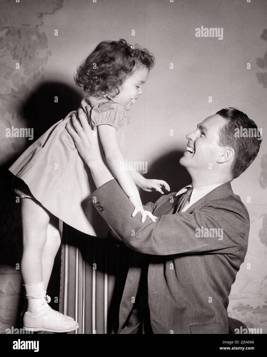 1930s 1940s SMILING FATHER LIFTING UP HIS TODDLER DAUGHTER - j7615 ...