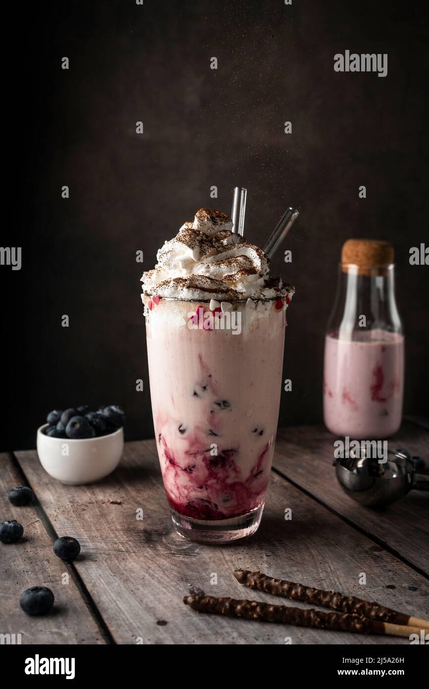 berry milkshake with cream and cocoa. with fresh blueberries. photo for ...
