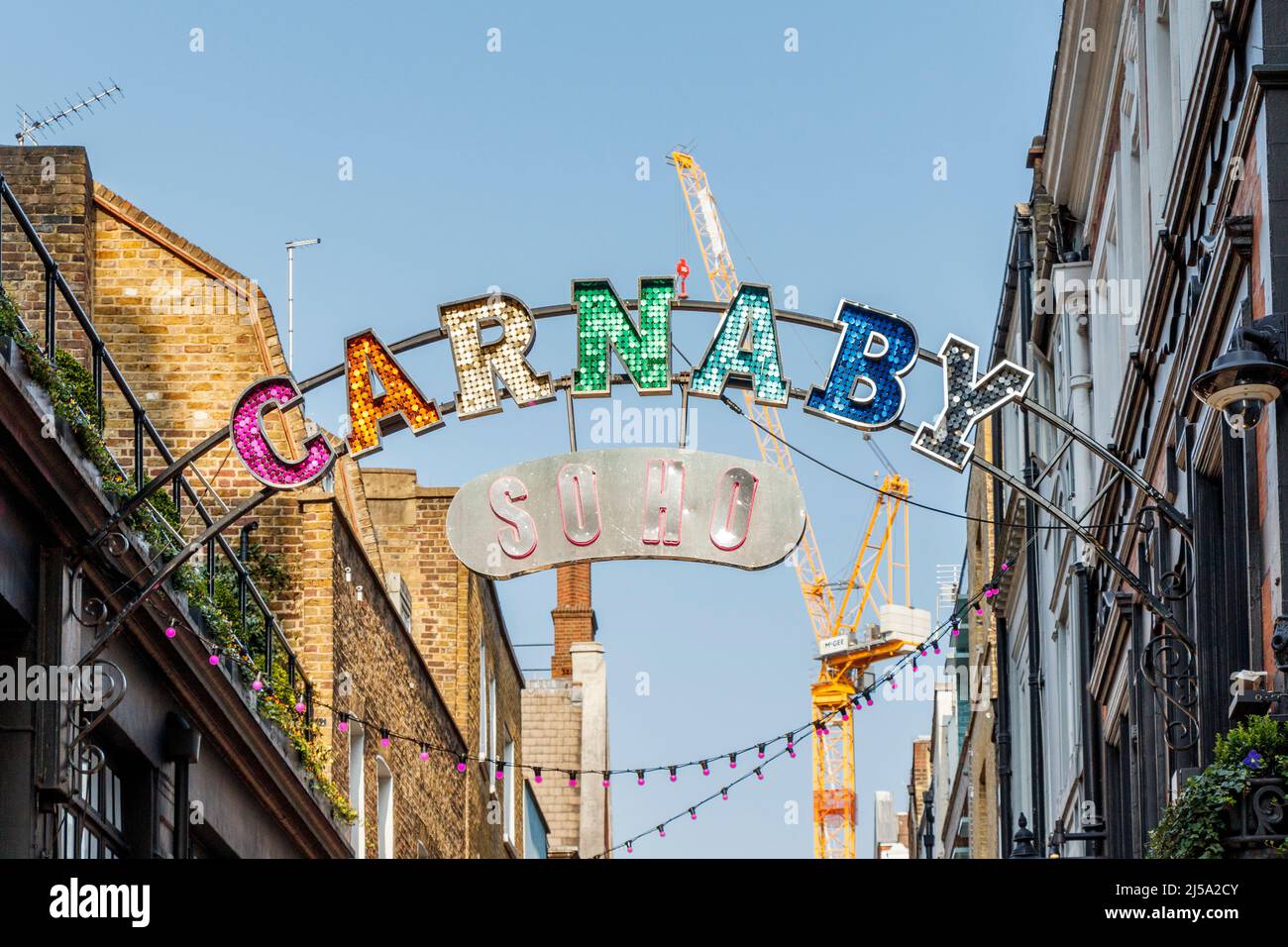 'Carnaby Soho' sign above Foubert's Place, a pedestrianised shopping ...