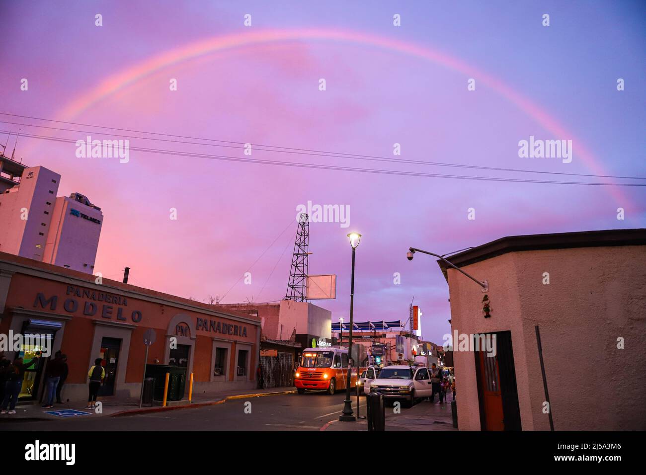 Rainbow, reddish day during sunset in the center of Hermosillo Mexico ...